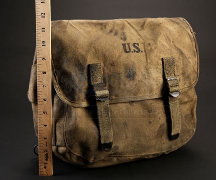 The satchel shows some frays along its seams, but remains in otherwise ...