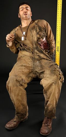 The dummy shows some wear, such as smudged paint, but remains in ...