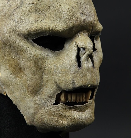 A detailed Orc mask and teeth worn in Peter Jackson’s fantasy ...