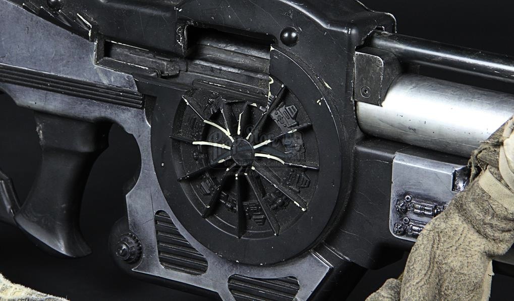 Well-used with some paint wear and damage to the fins on the rifle’s ...