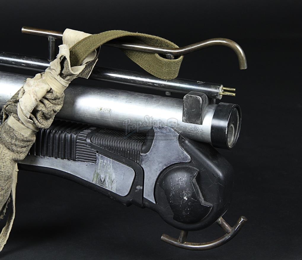 Well-used with some paint wear and damage to the fins on the rifle’s ...